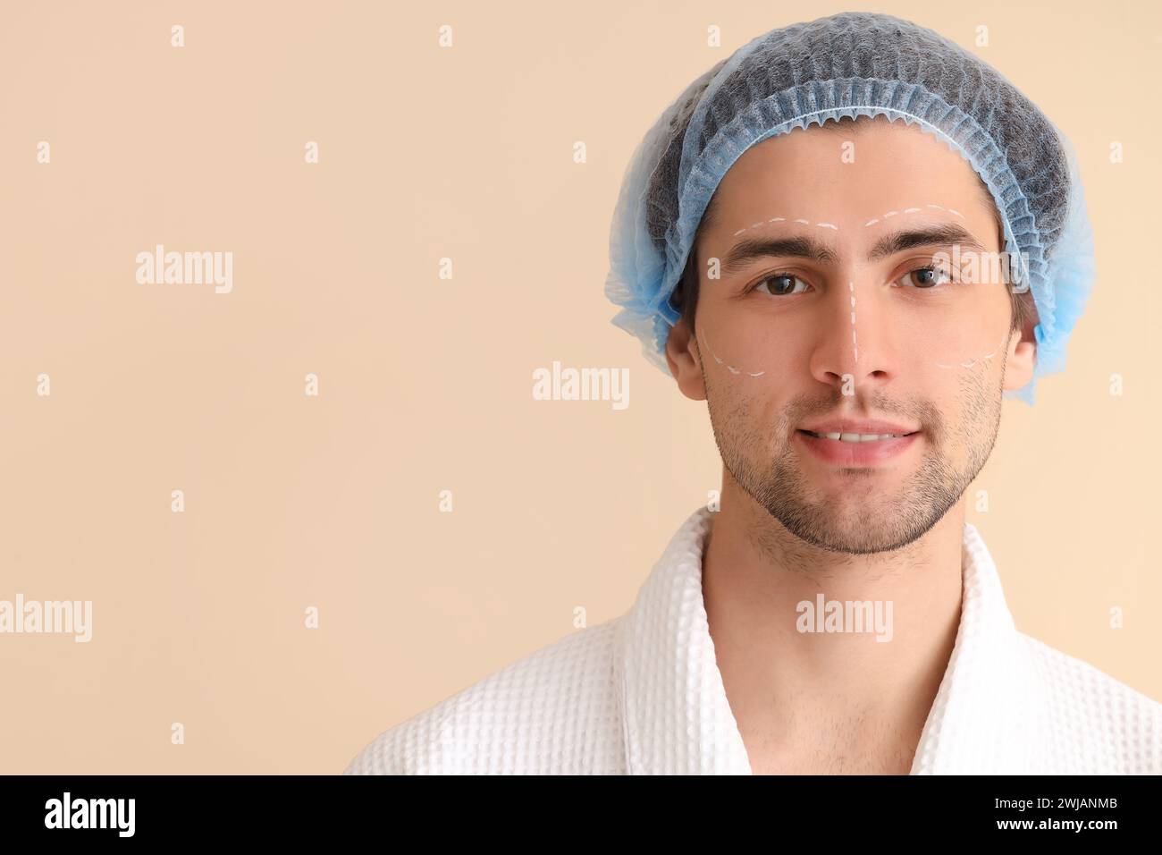 Handsome man with marked face on beige background, closeup. Plastic ...