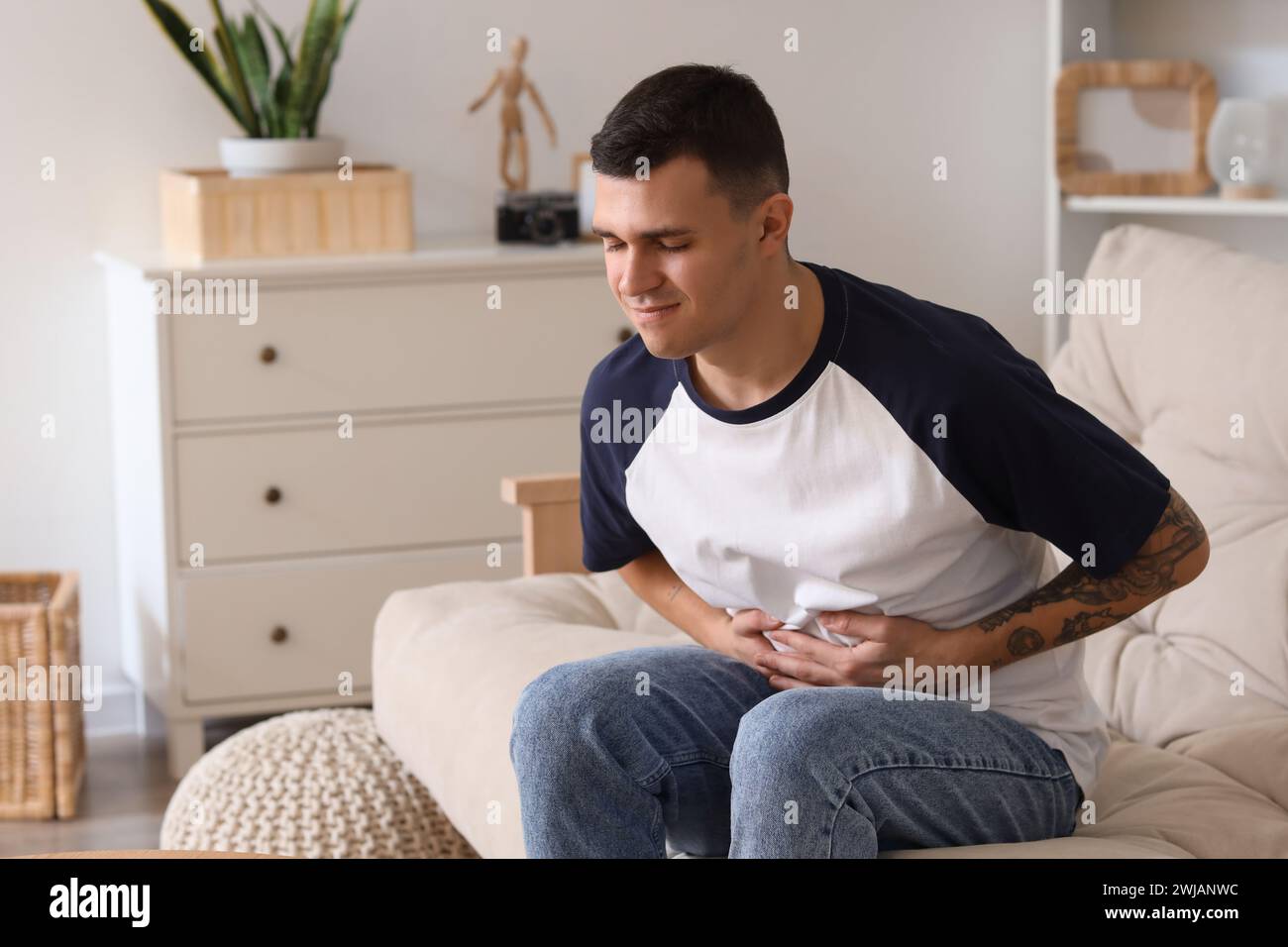 Bellyache man hi-res stock photography and images - Alamy