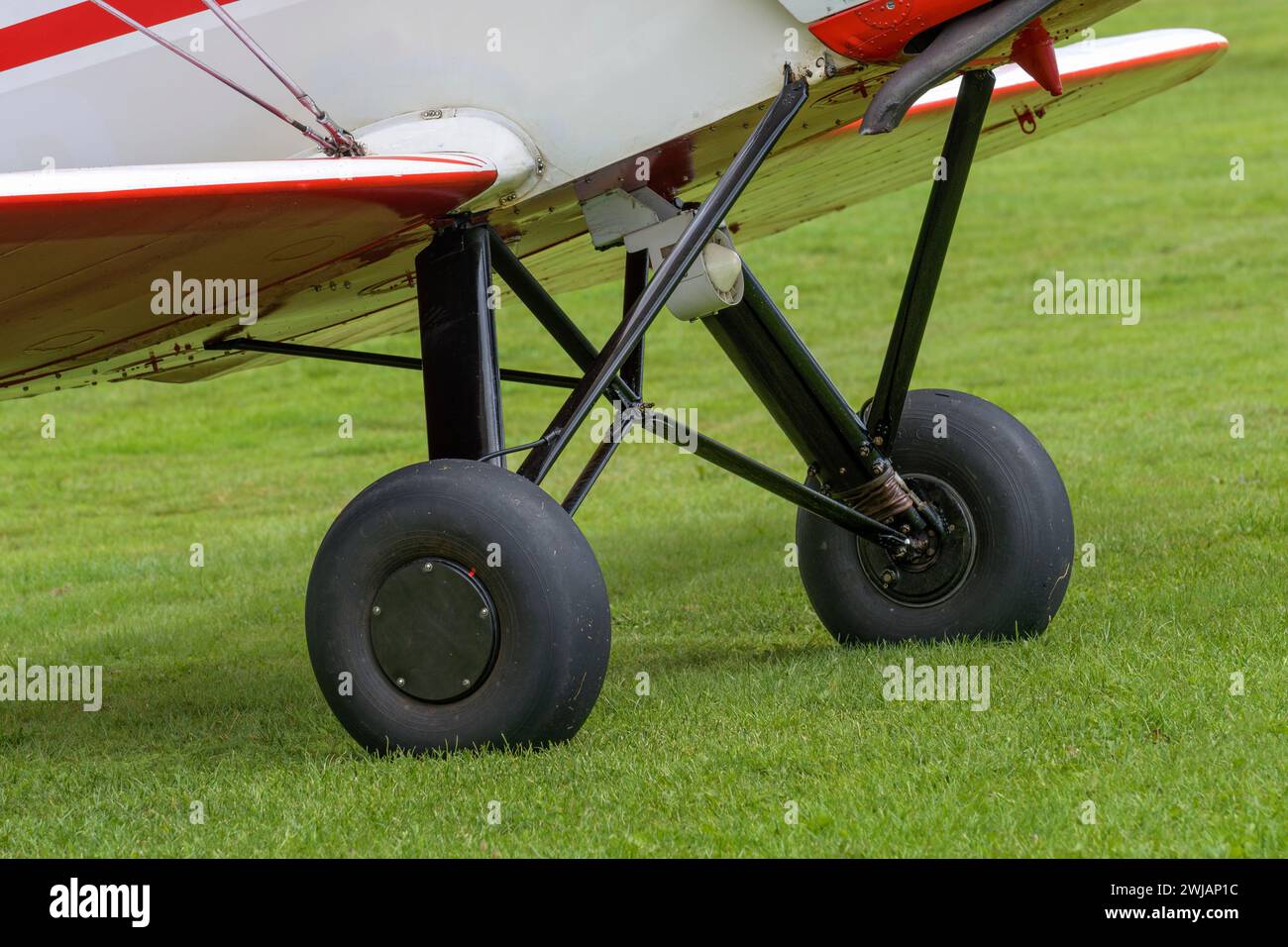 Chassis of a light sports aircraft on a grass field close-up Stock ...