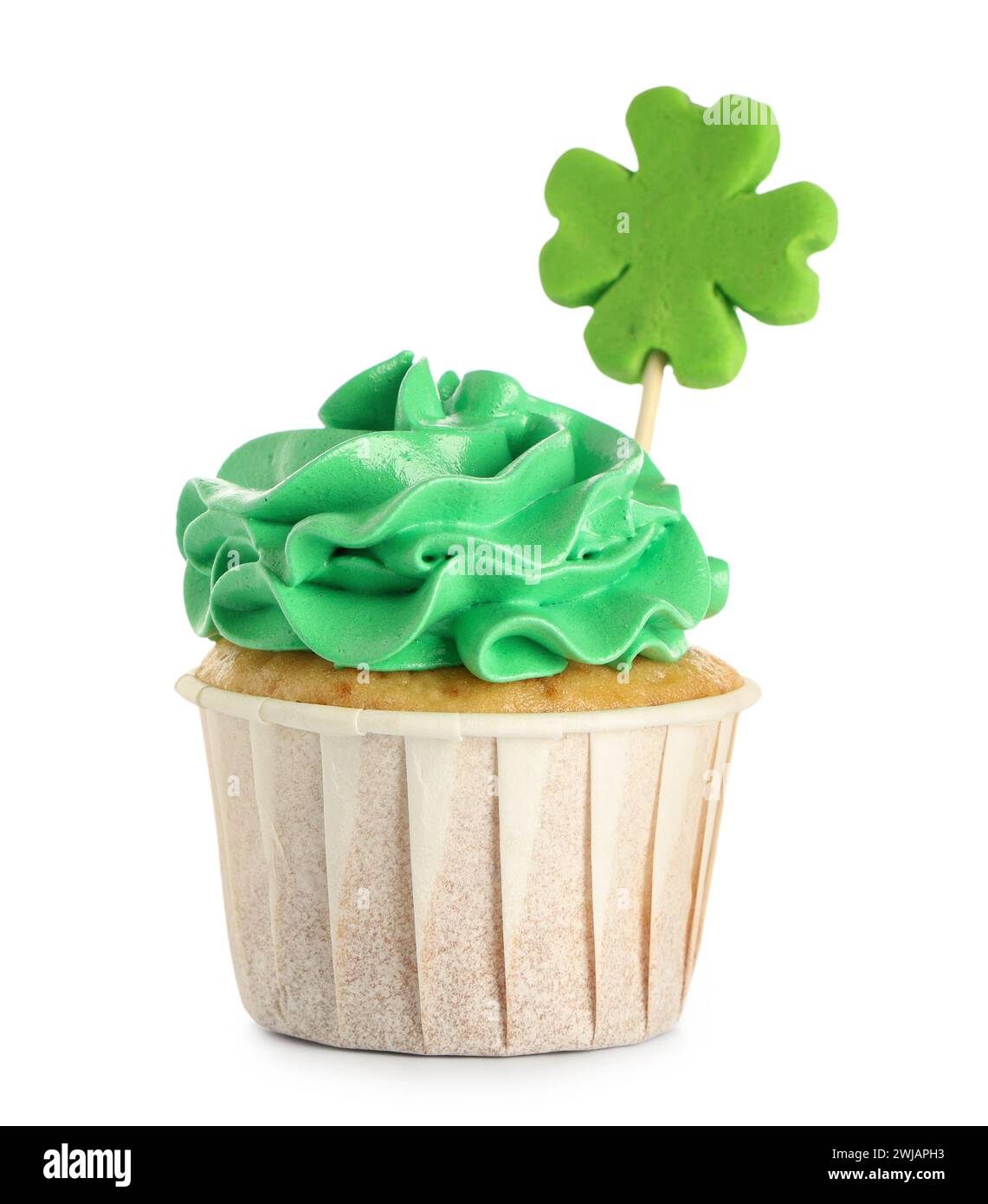 Tasty green cupcake with clover for St. Patrick's Day on white ...