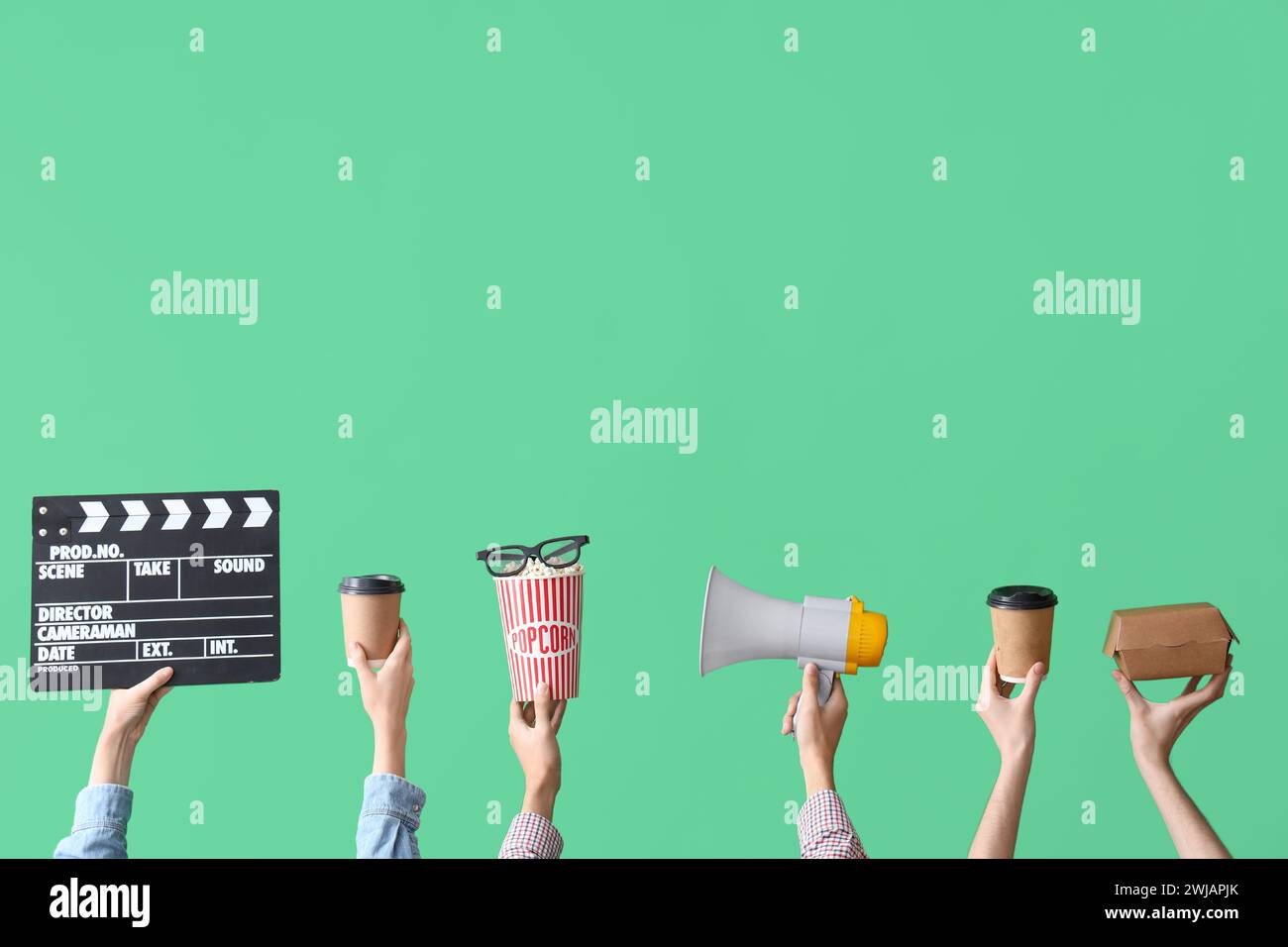 Many hands with movie clapper, drinks and food on green background ...