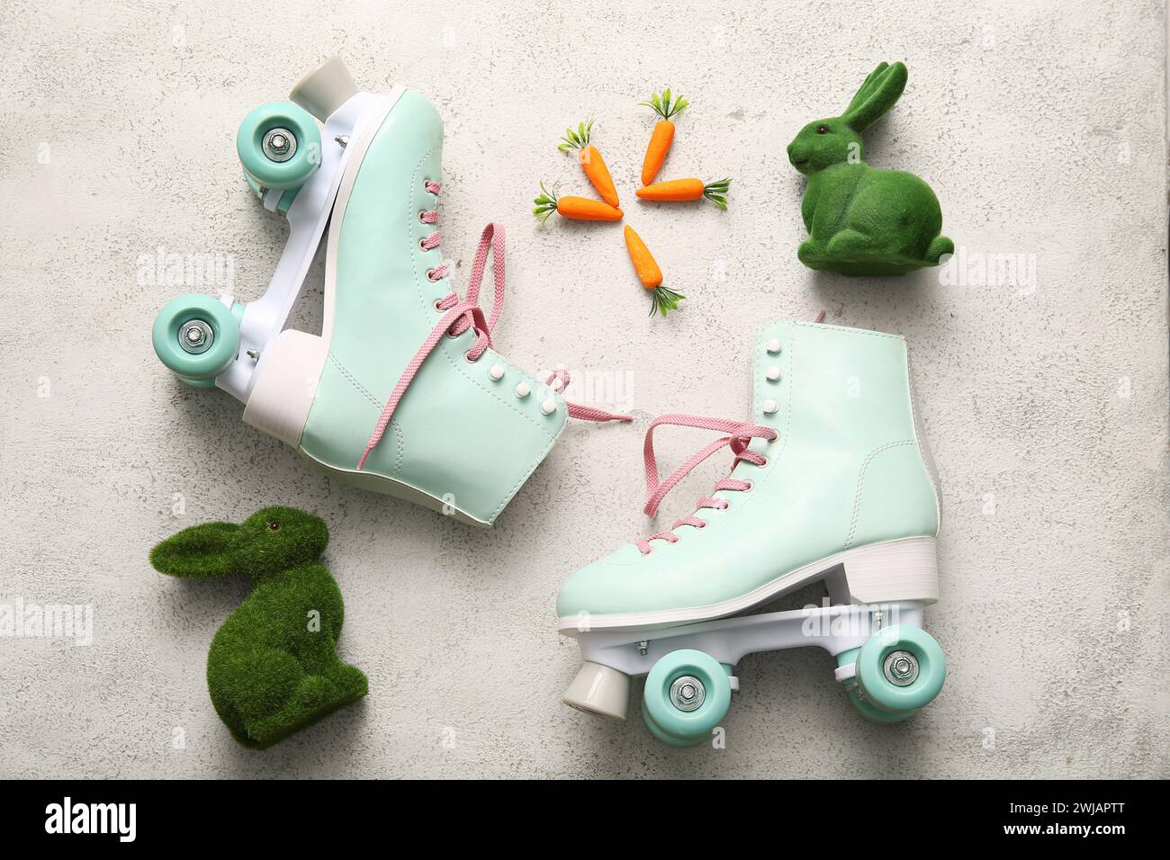 Vintage roller skates with toys bunny and carrots on white background ...
