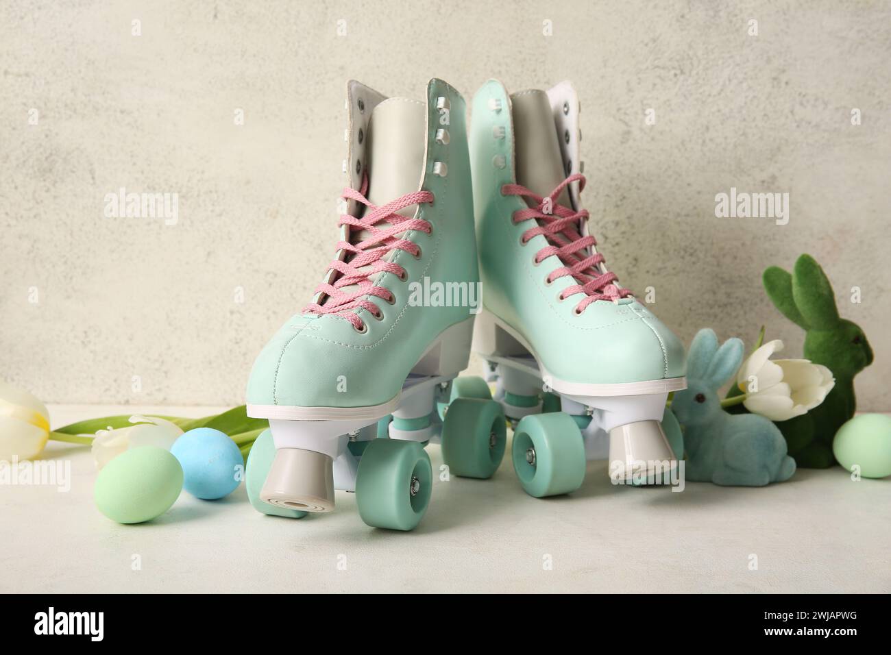 Vintage roller skates with Easter eggs, beautiful tulips and toys bunny ...