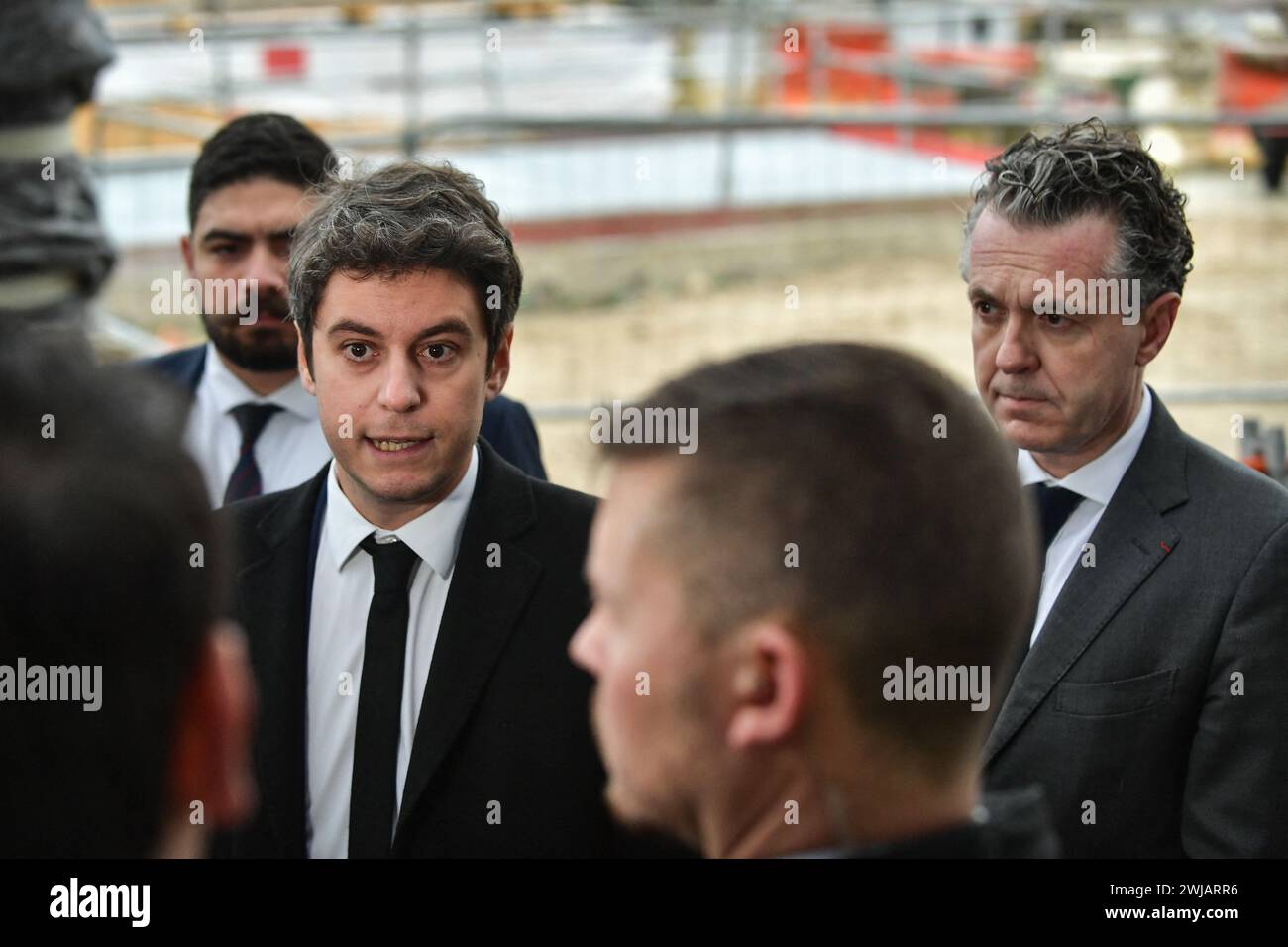 Paris, France. 14th Feb, 2024. French Prime Minister Gabriel Attal (C ...