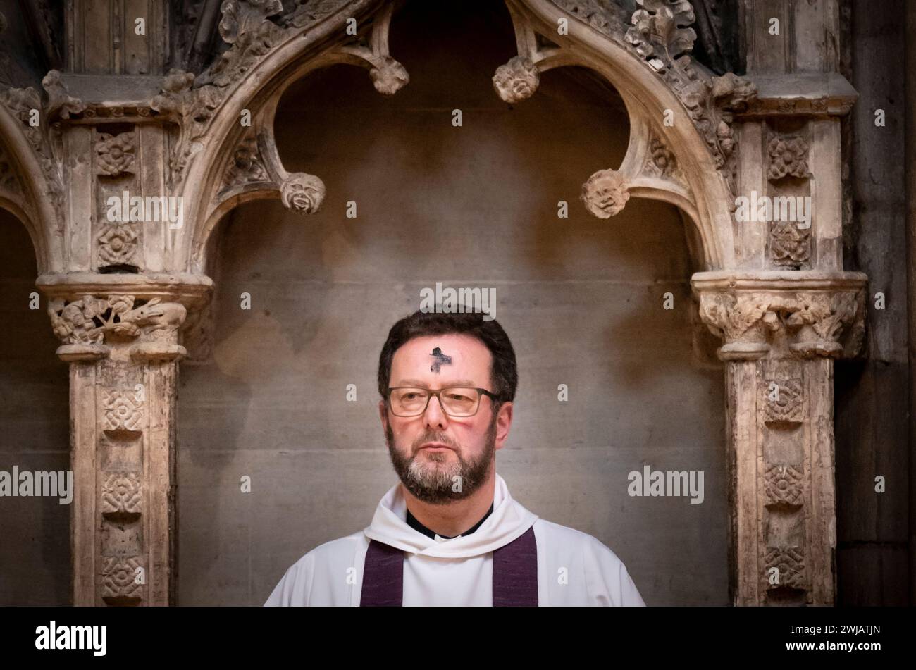 Canon Matthew Pollard, with an ash cross on his forehead, during the ...