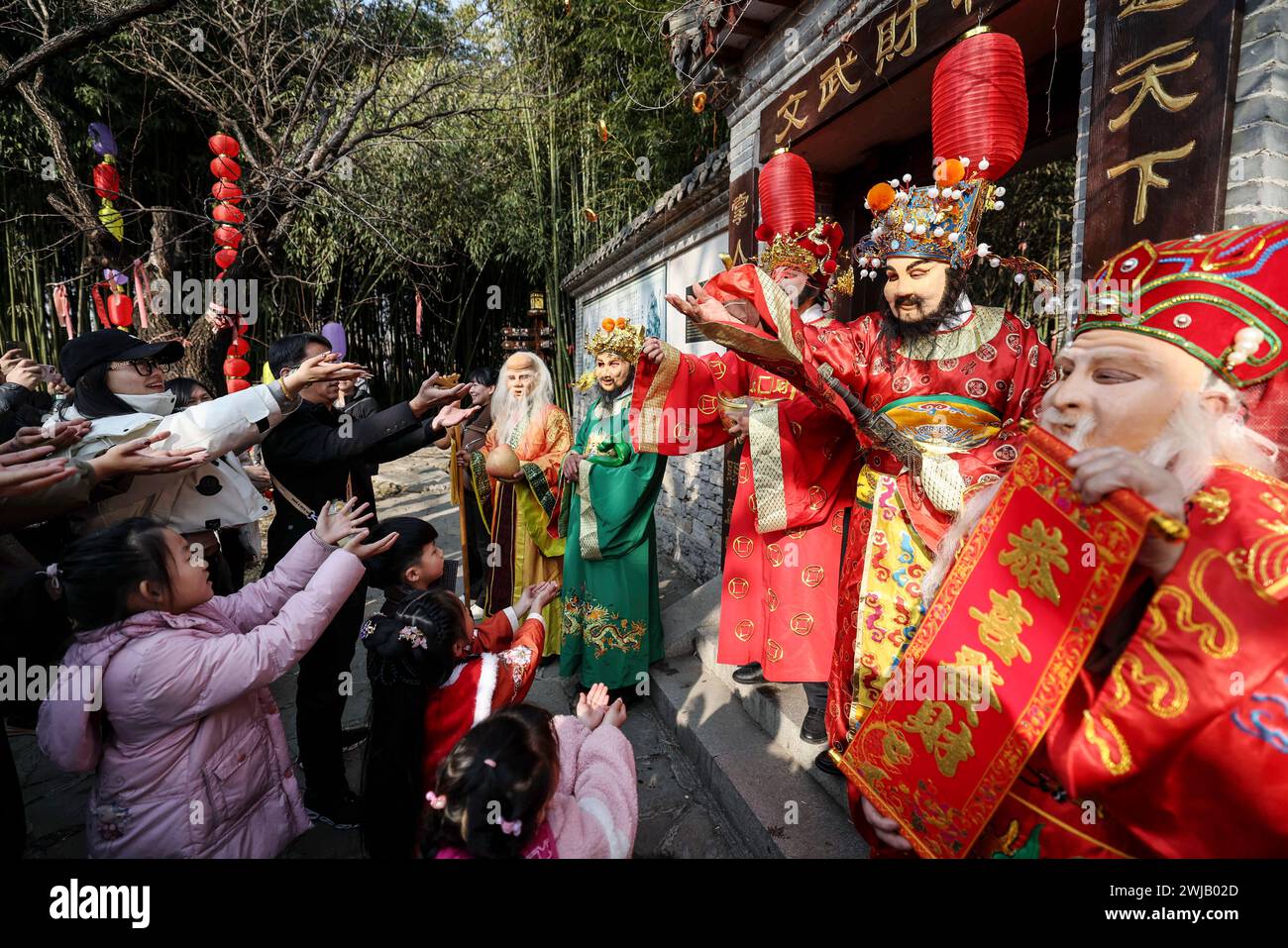 Beijing, China's Shandong Province. 14th Feb, 2024. Staff members in ...