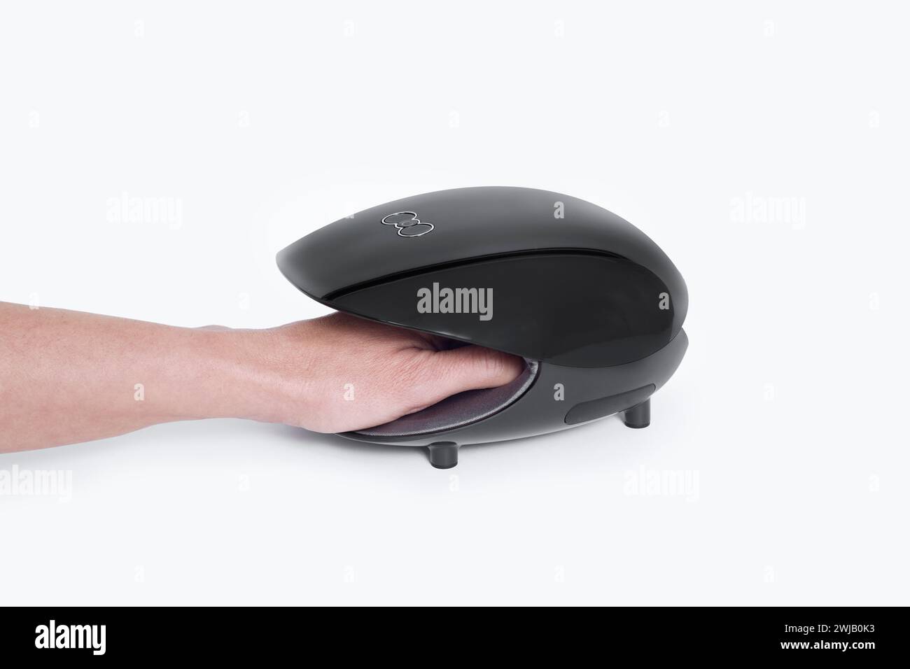 man using a hand massager Stock Photo - Alamy