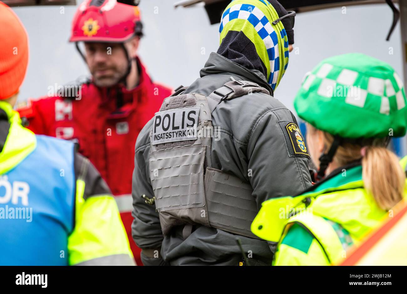Staff from rescue services, Swedish police task force and ambulance ...