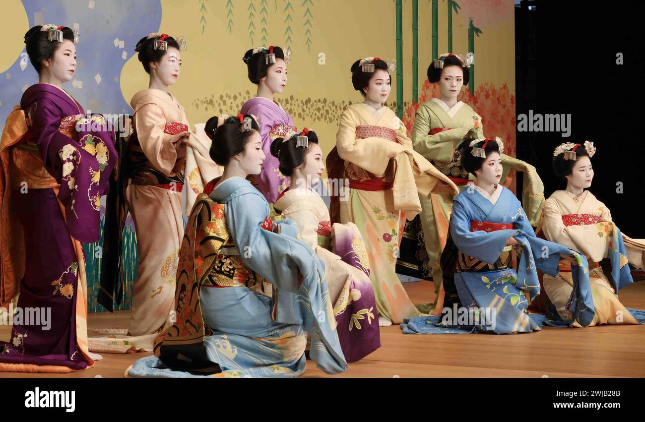Geiko, geisha and maiko (apprentice geiko) pose for a photograph ahead ...