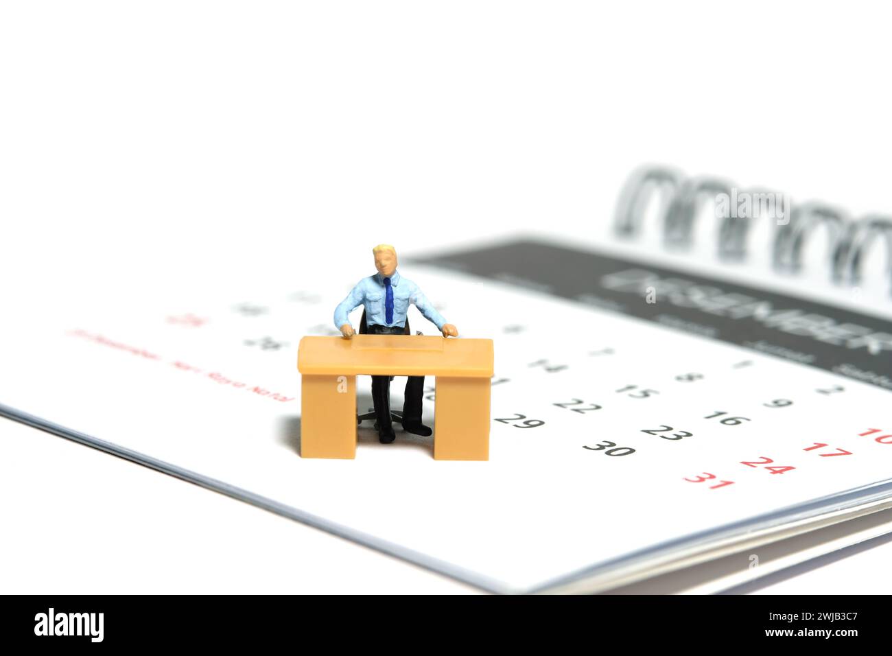 Miniature tiny people toy figure photography. Due date concept. A ...