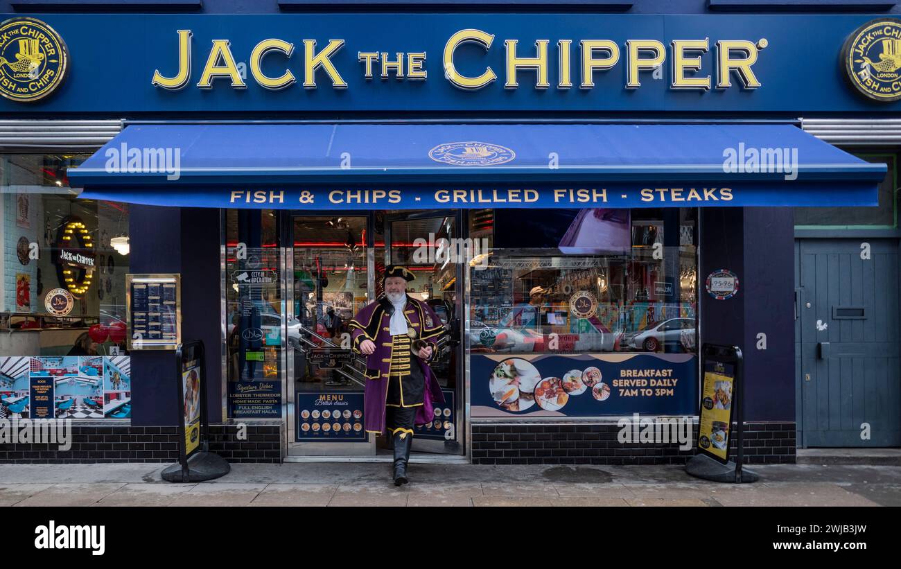 London, UK 14 February 2024. A fully costumed professional town crier ...