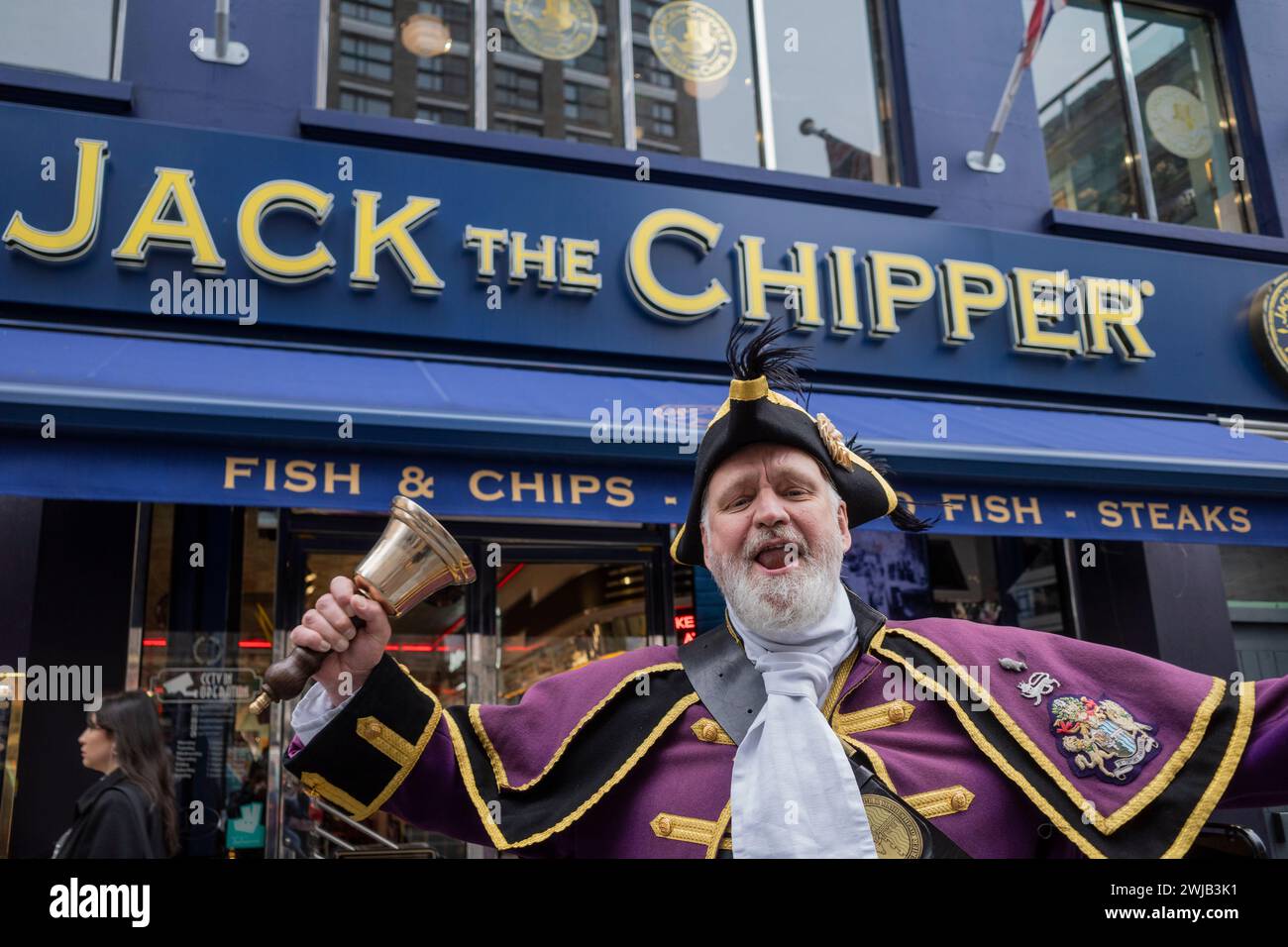 London, UK 14 February 2024. A fully costumed professional town crier ...