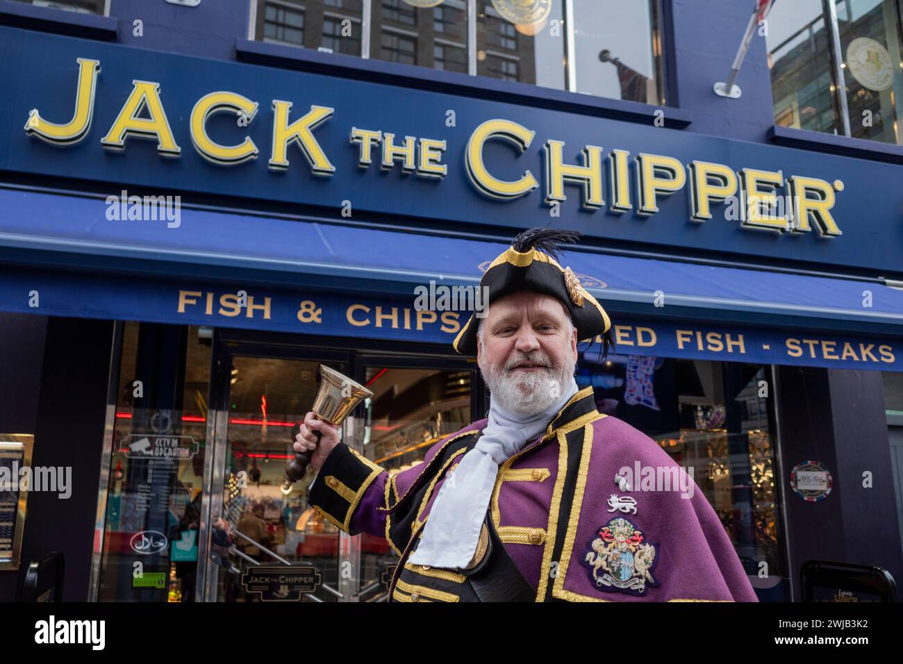 London, UK 14 February 2024. A fully costumed professional town crier ...