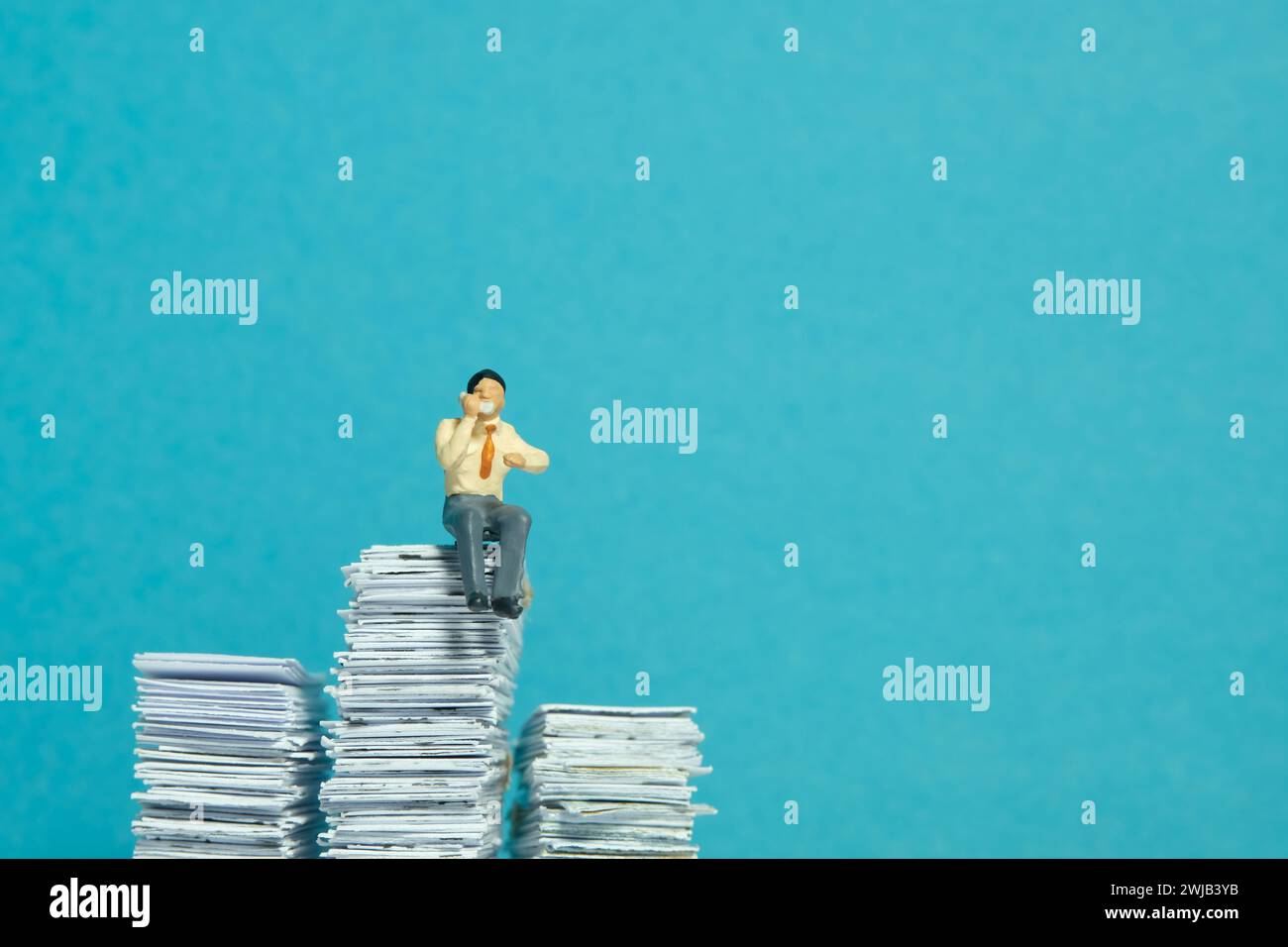Miniature tiny people toy figure photography. Call list concept. A ...