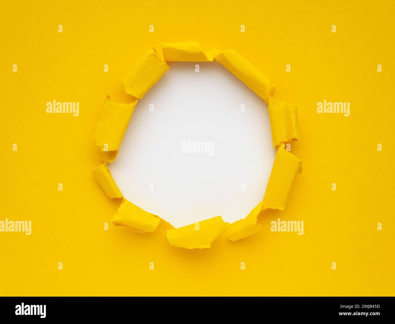 Yellow torn paper on white background. Breaking paper effect Stock ...