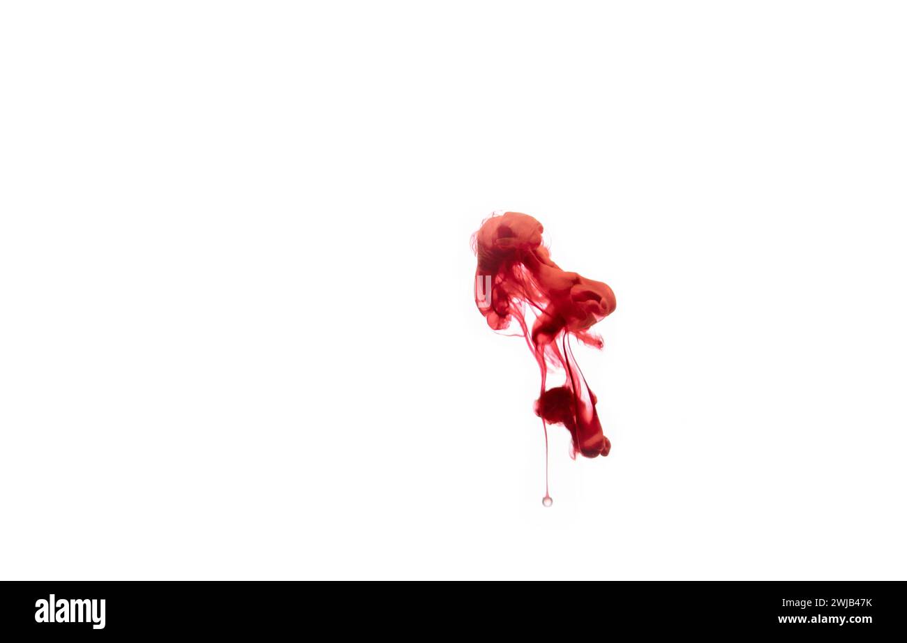 Colors dropped into liquid and photographed while in motion on white ...