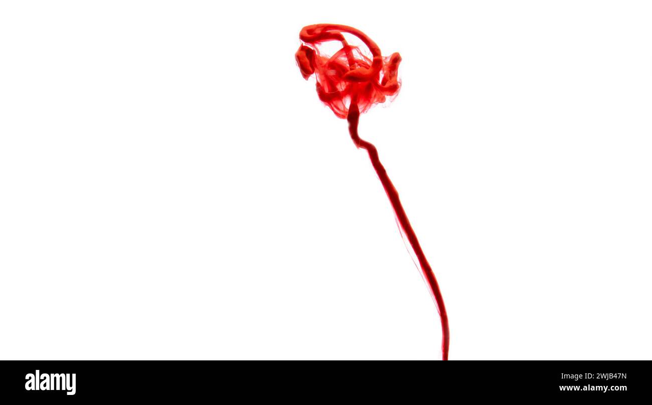 Colors dropped into liquid and photographed while in motion on white ...