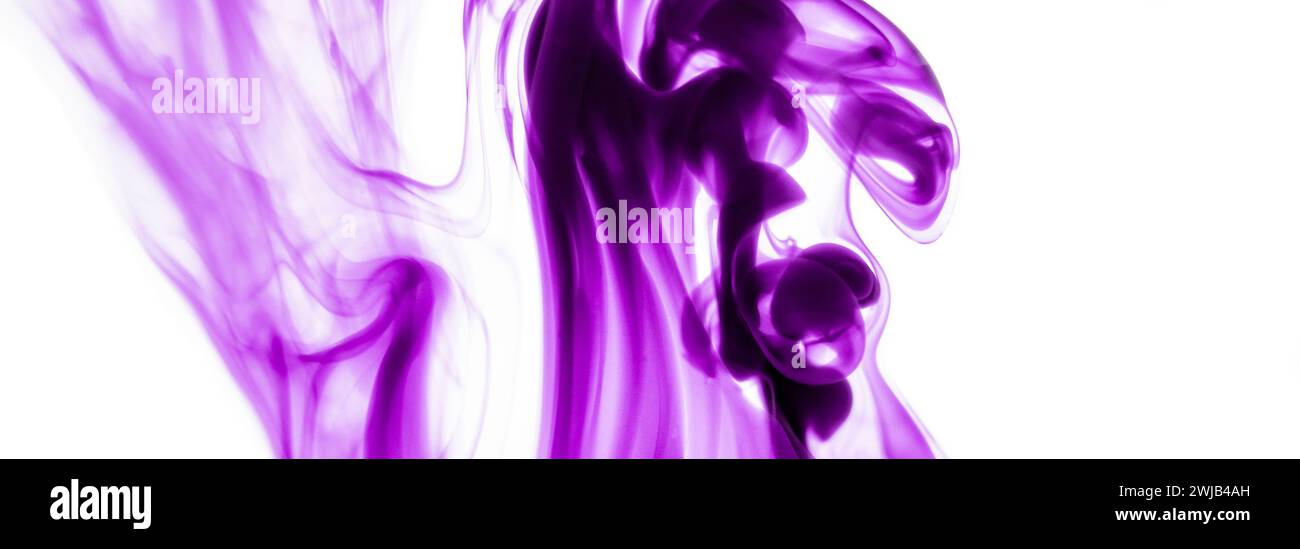 Colors dropped into liquid and photographed while in motion on white ...