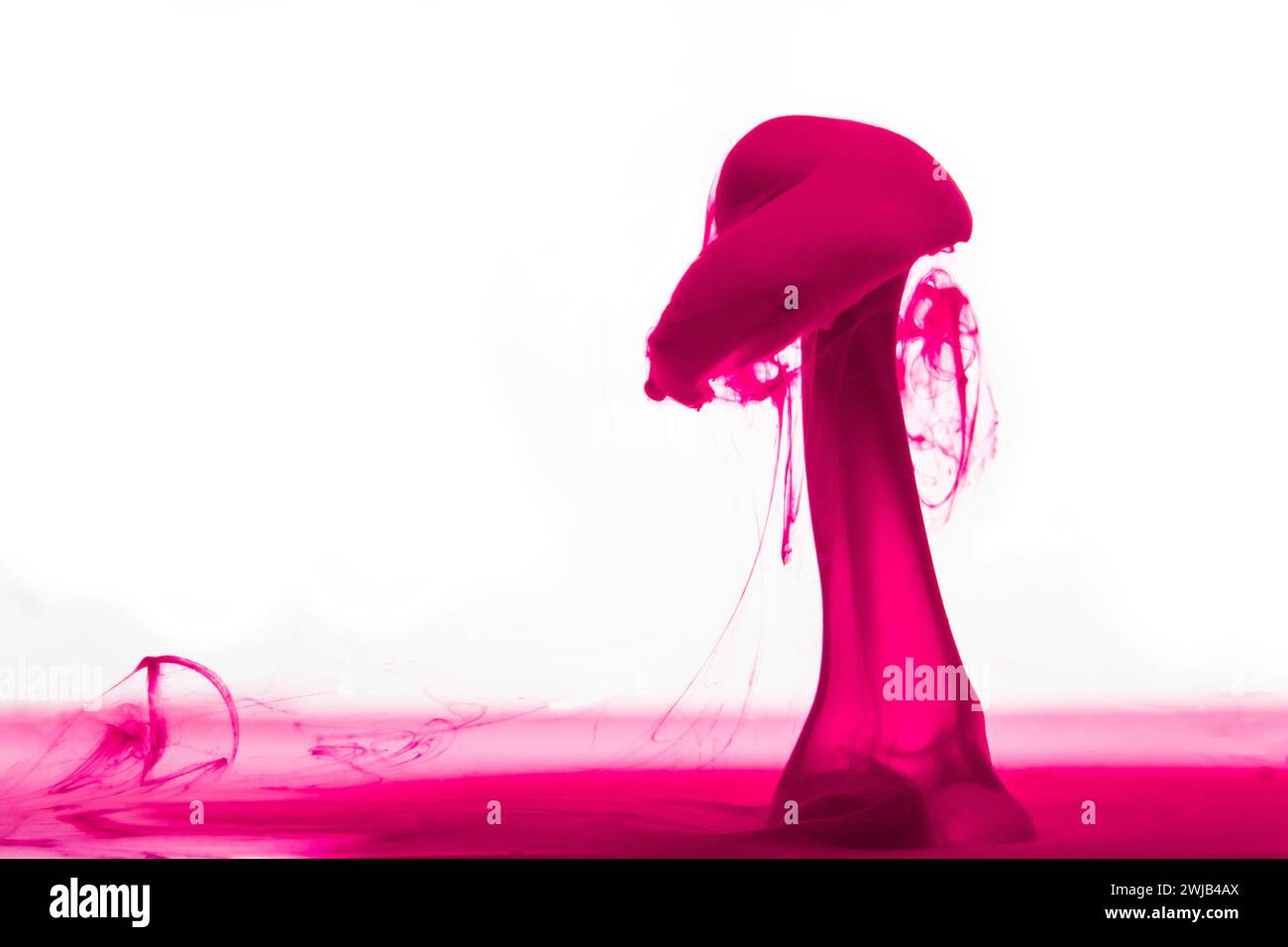 Colors dropped into liquid and photographed while in motion on white ...