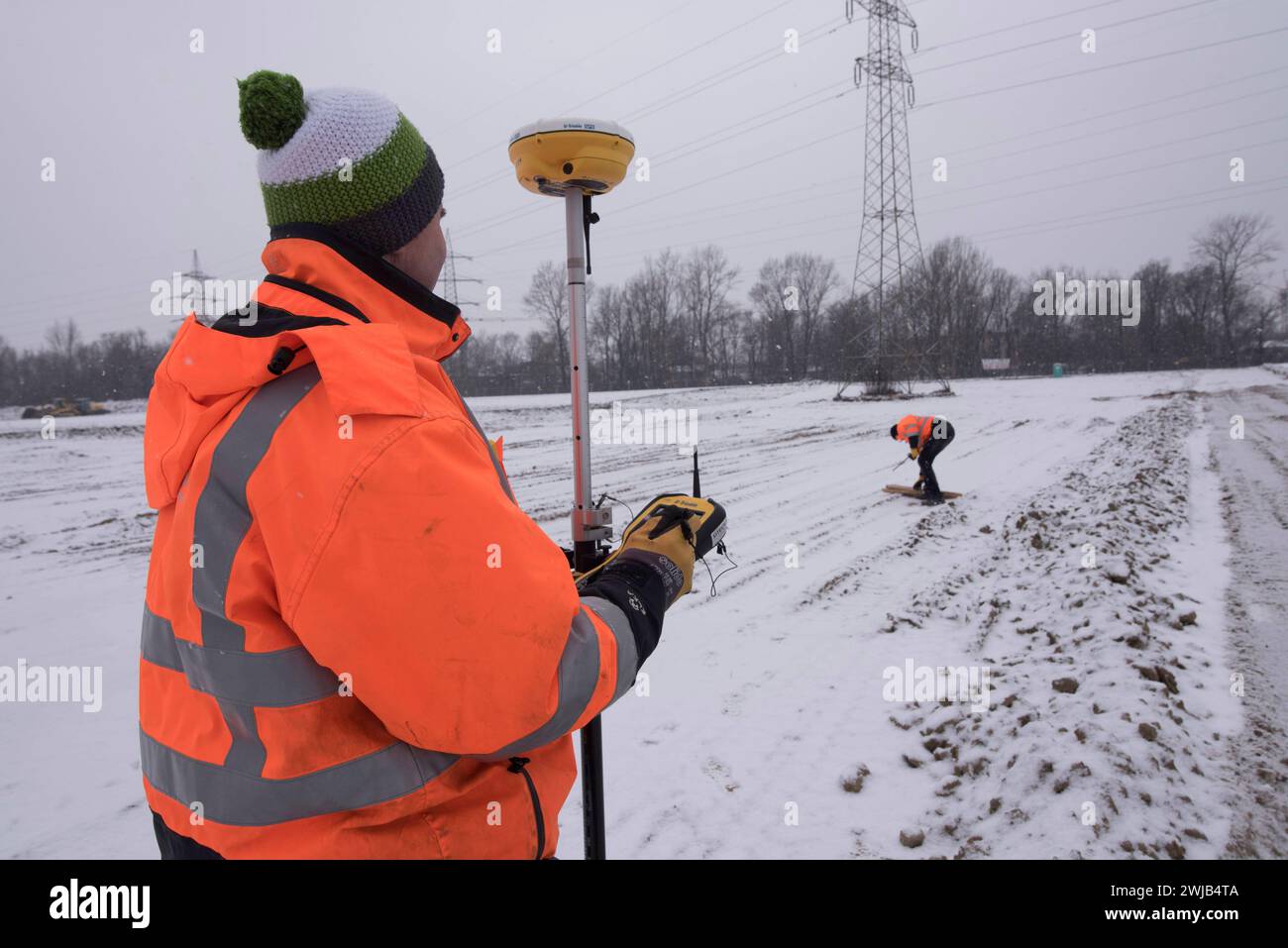 surveying by a land surveyor with measure instruments in geodesy surveying by a land surveyor in ...