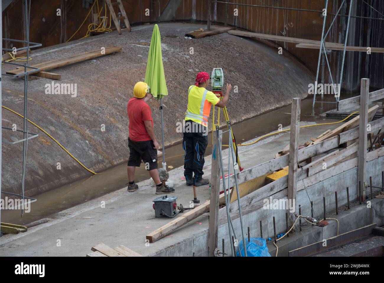 surveying by a land surveyor with measure instruments in geodesy surveying by a land surveyor in ...