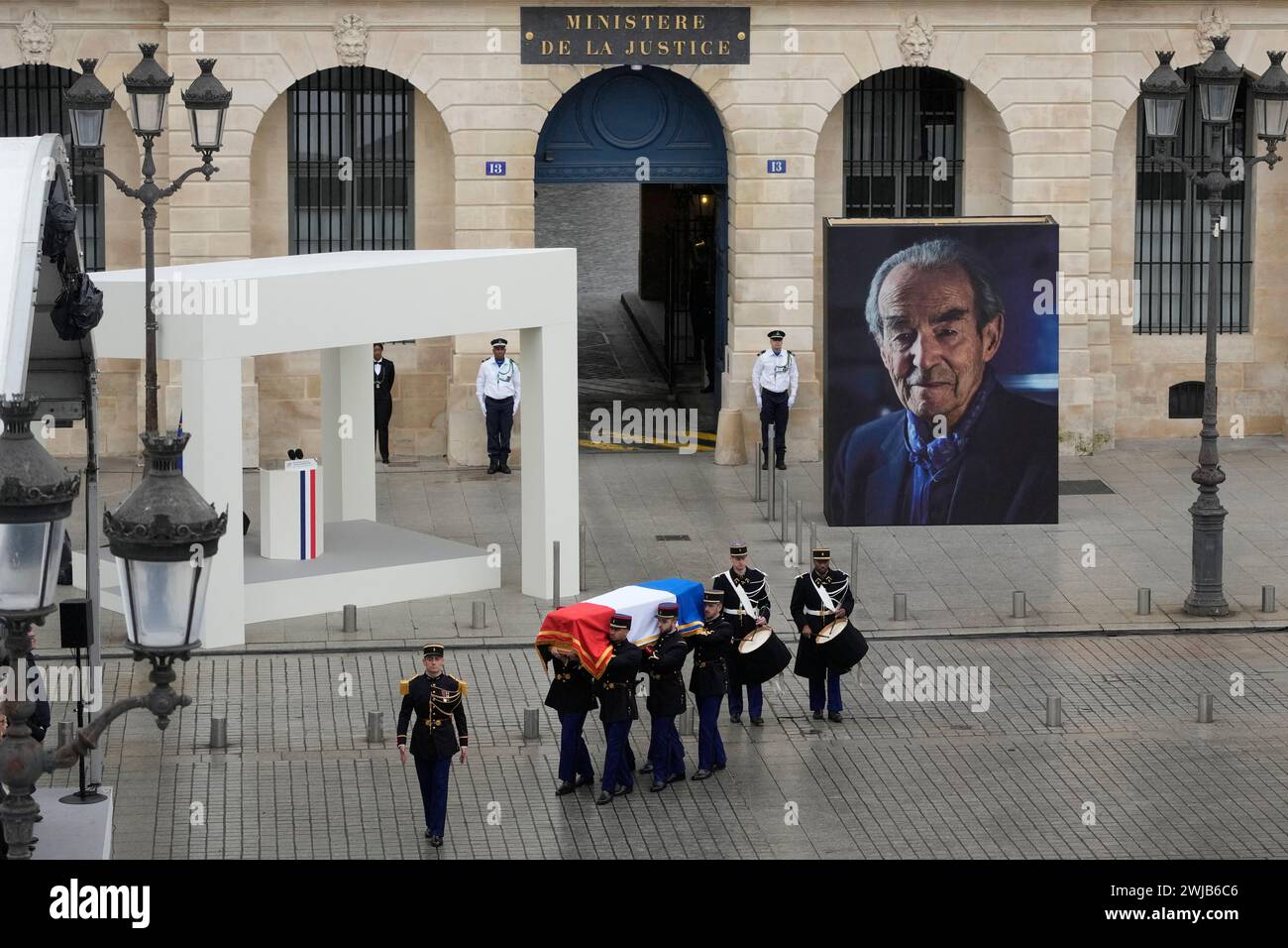 Paris, France. 14th Feb, 2024. Republican Guards carry the coffin of ...