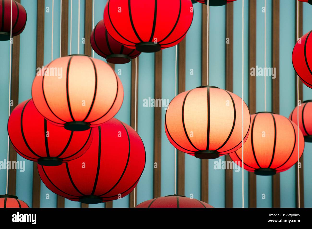 Floating globe lamps against vertical stripes providing a unique ...