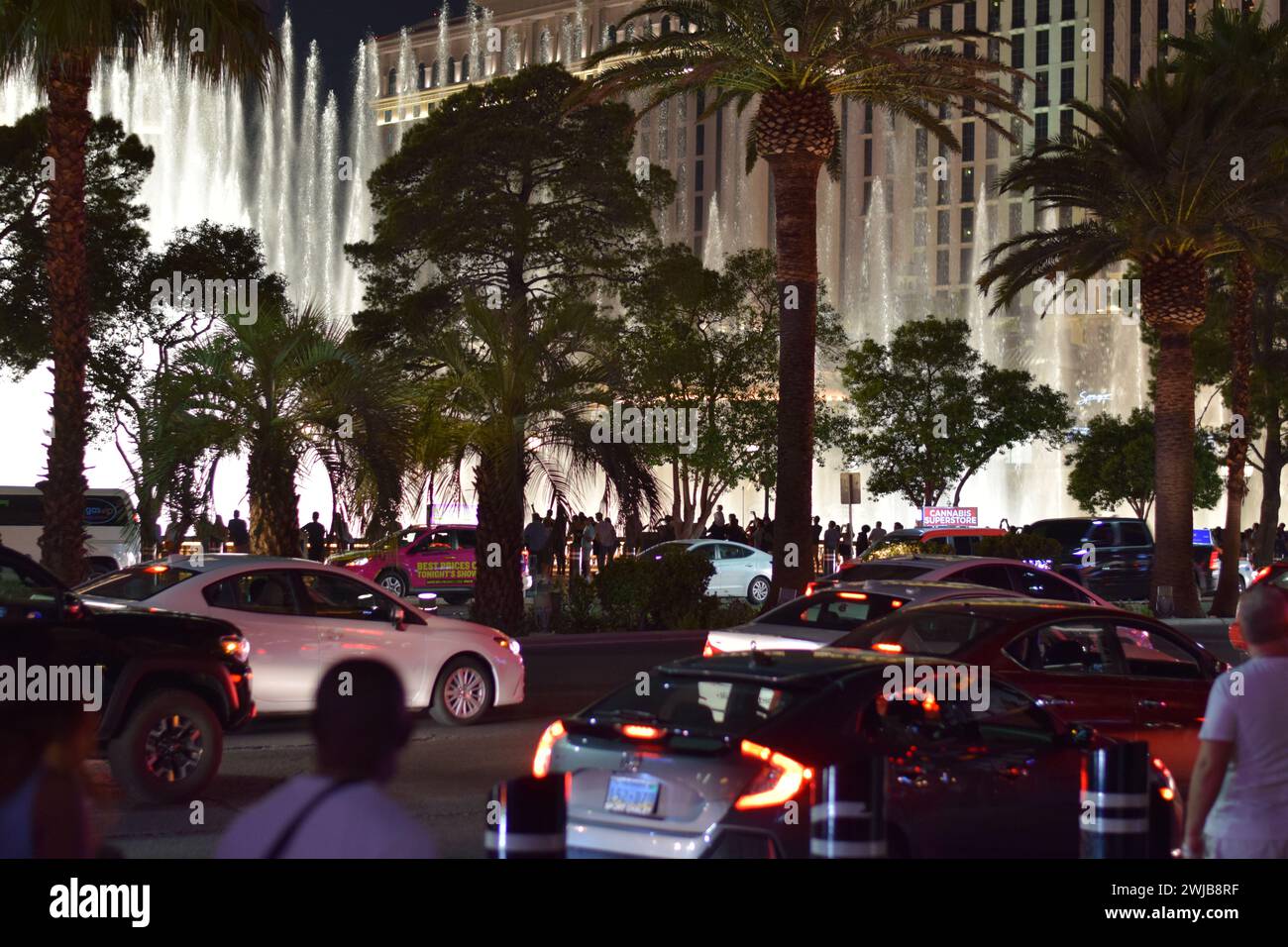 Las Vegas night street scene with side walk crowds watching the ...