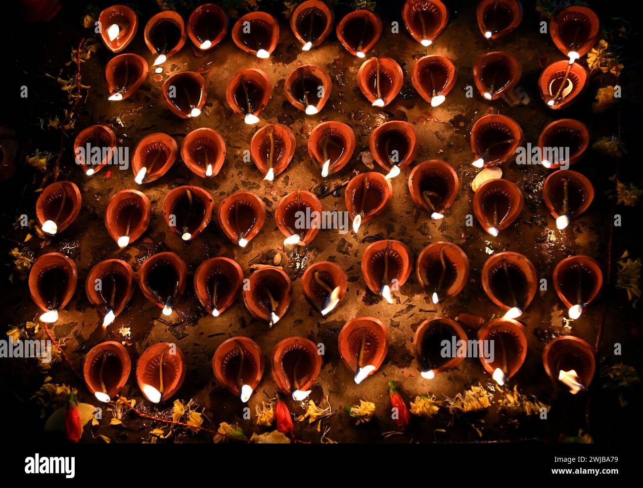 Indian females performing evening prayer offering with floating clay ...