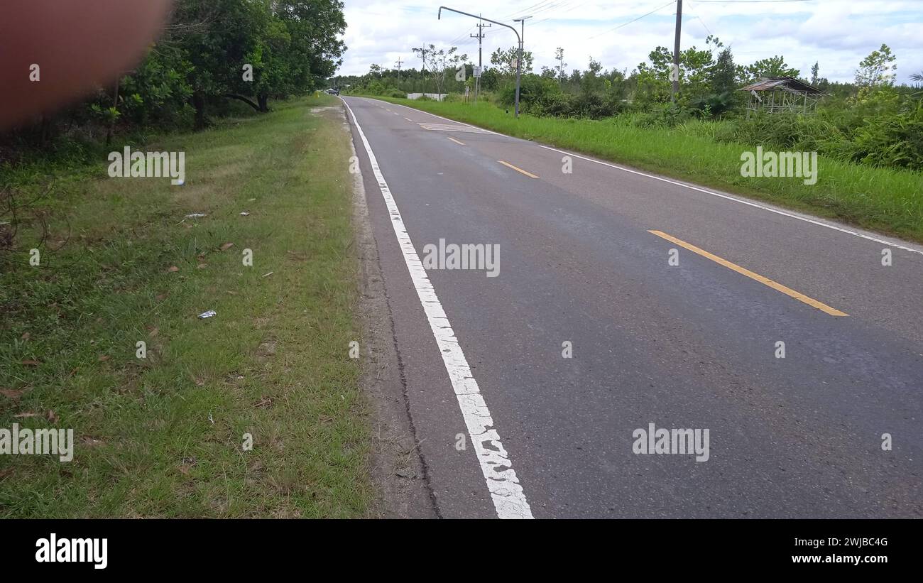 White solid line. Road markings on asphalt on the street Stock Photo ...
