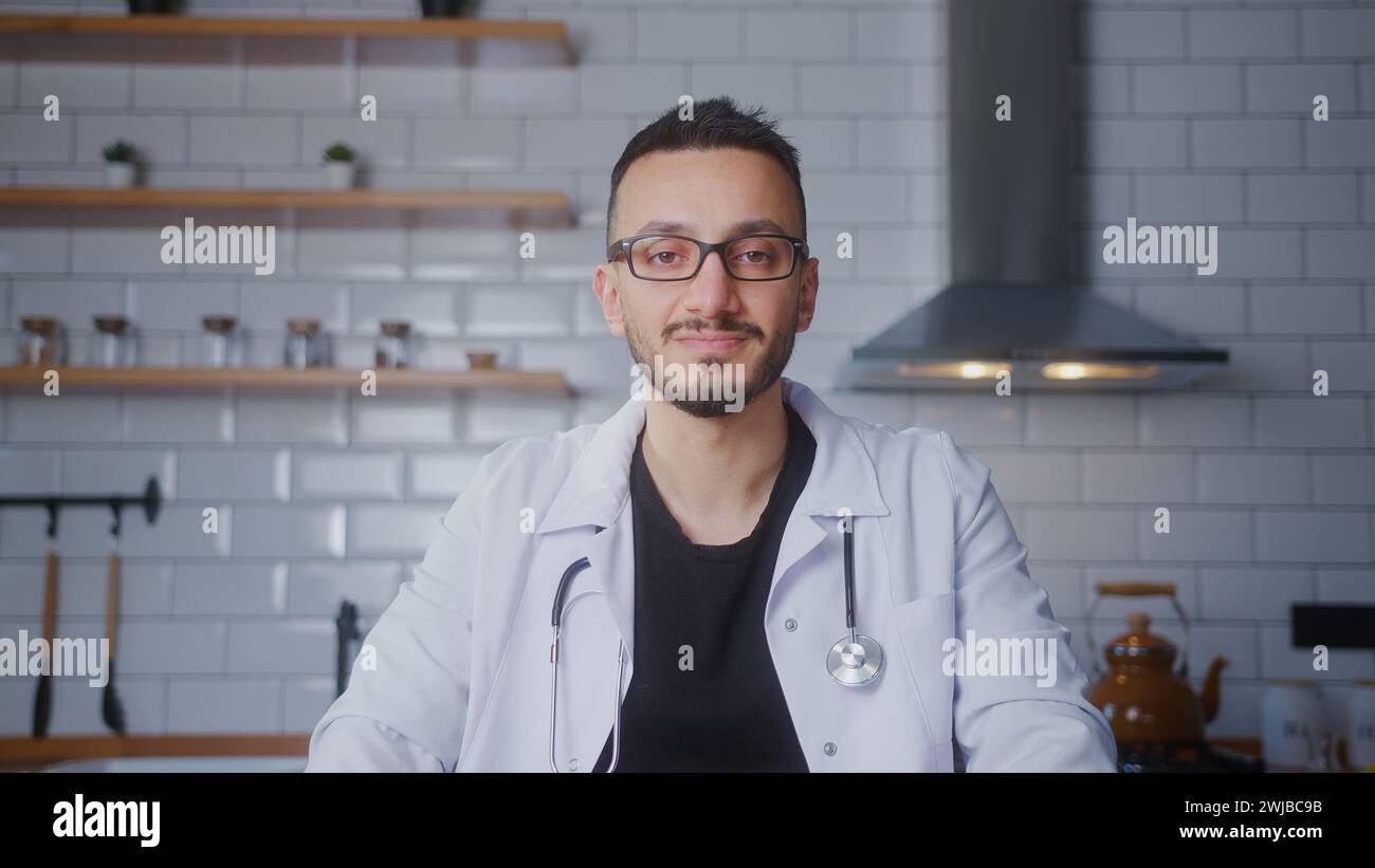 Male doctor with glasses wear white uniform with stethoscope having ...