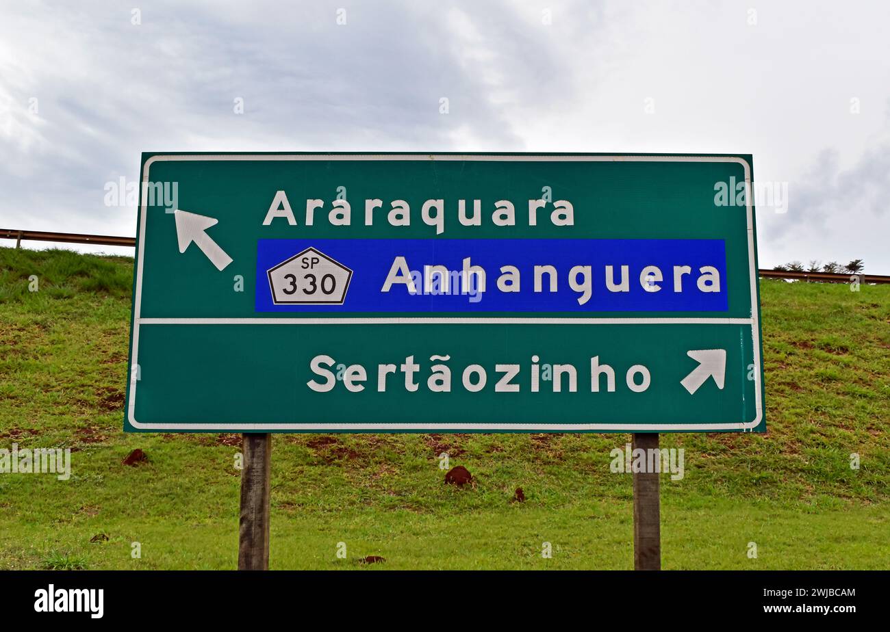 Walking route sign indicating road and nearby cities Stock Photo - Alamy