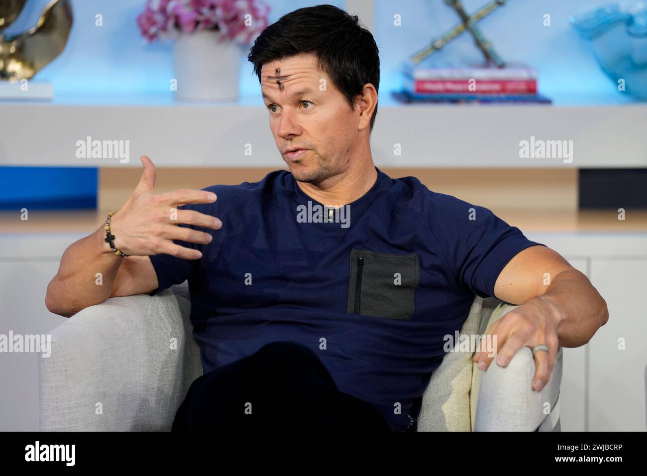 Mark Wahlberg bears a cross of ashes on his forehead as he appears on ...