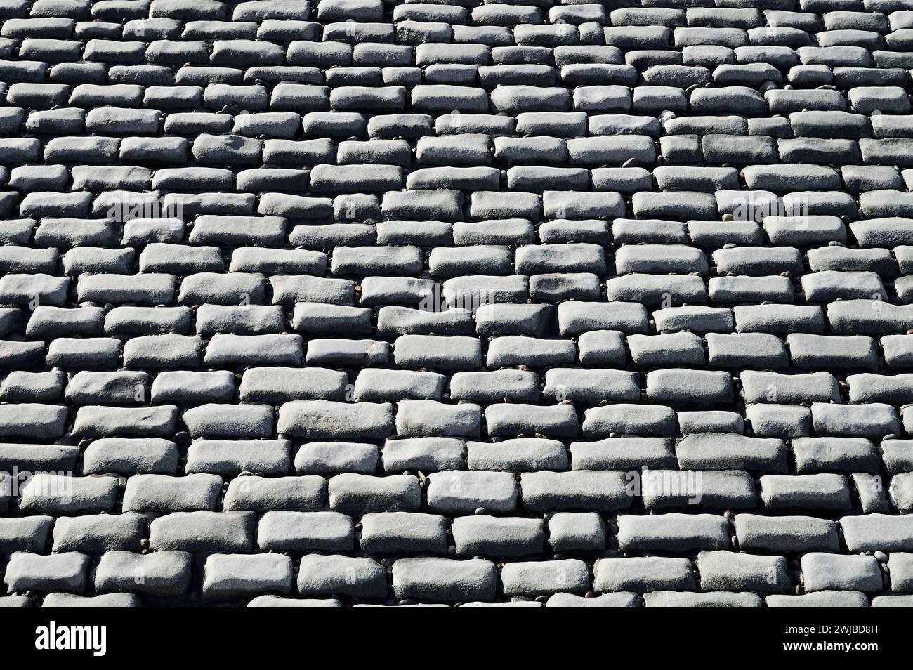 Cobble stones on sloping surface Stock Photo - Alamy