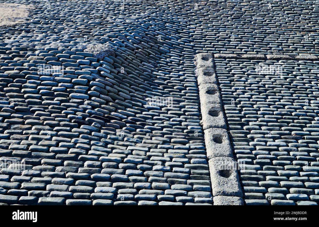 Cobble stones on sloping surface Stock Photo - Alamy