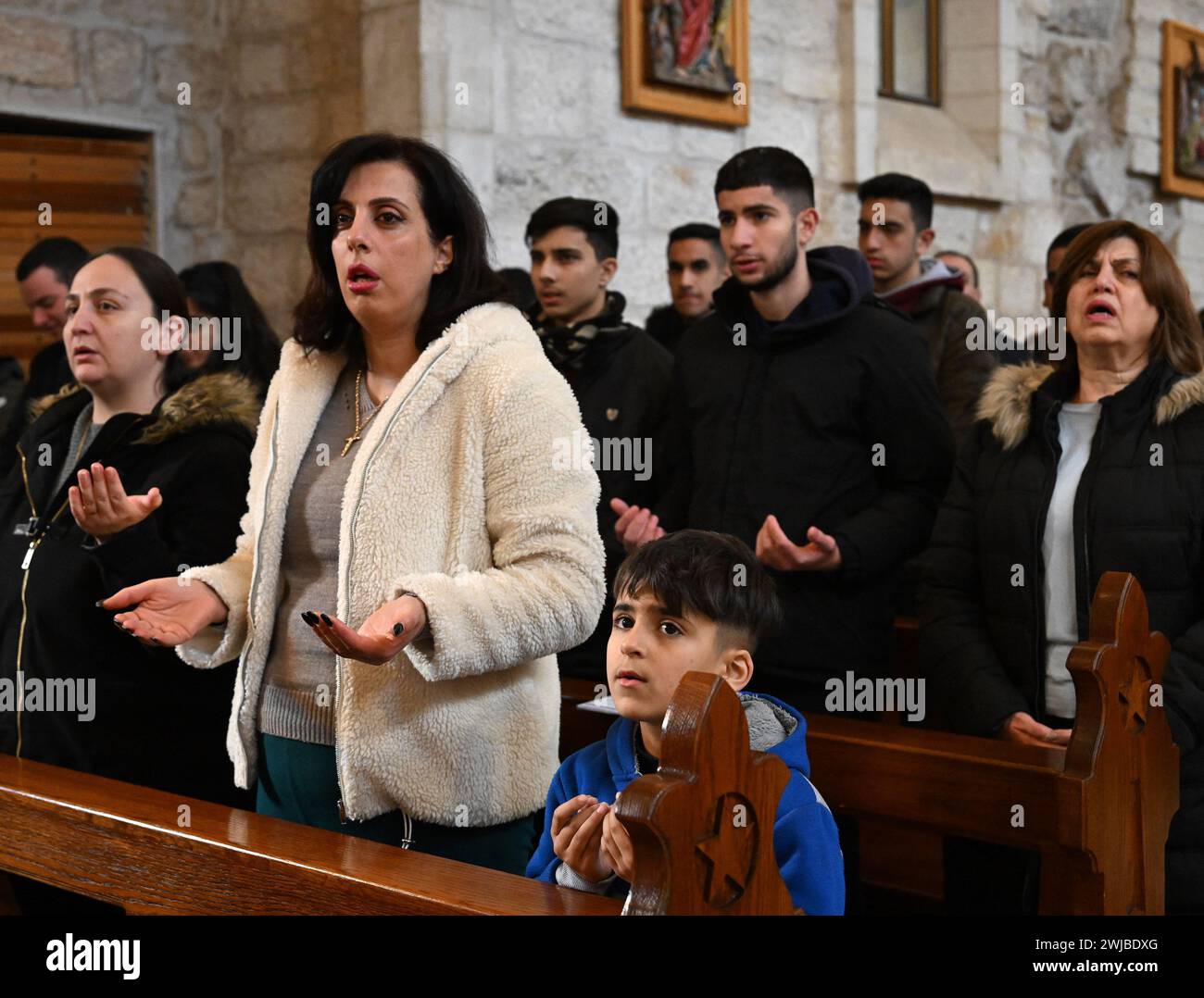 Bethlehem, West Bank. 14th Feb, 2024. Palestinian Catholics pray during ...
