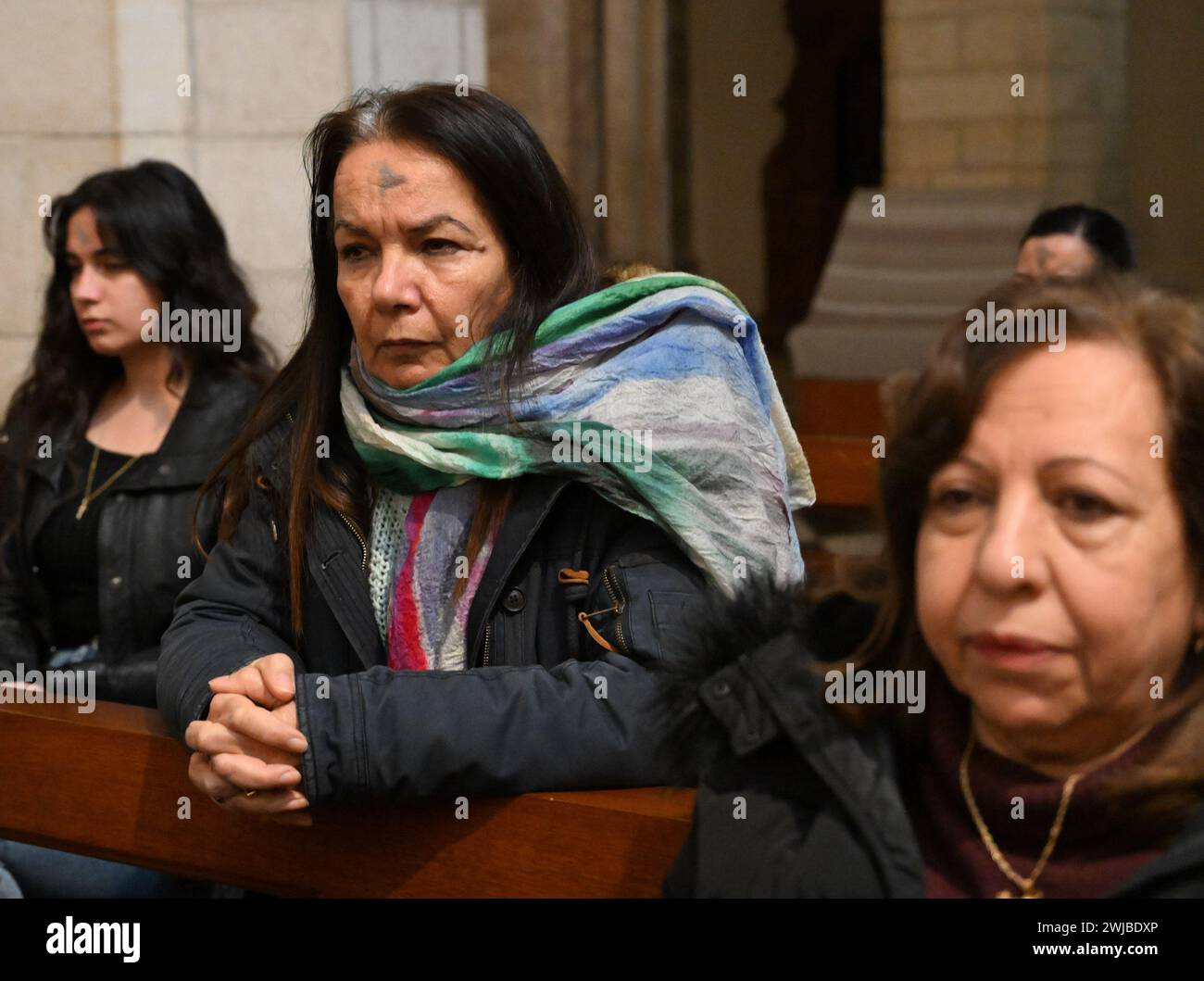 Bethlehem, West Bank. 14th Feb, 2024. Palestinian Catholics pray with ...