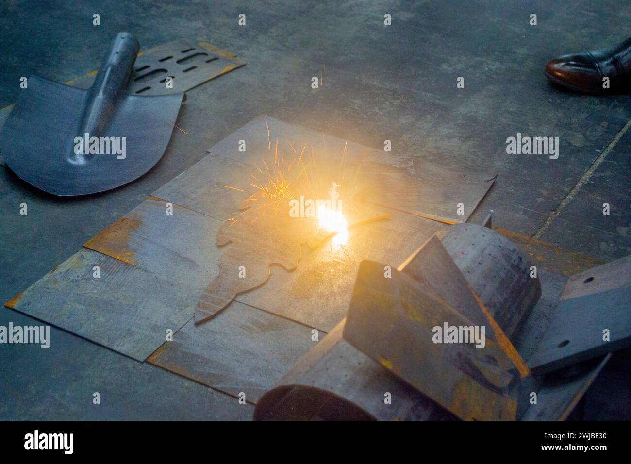 Laser cleaning of metal. The laser beam cleans the metal surface from ...