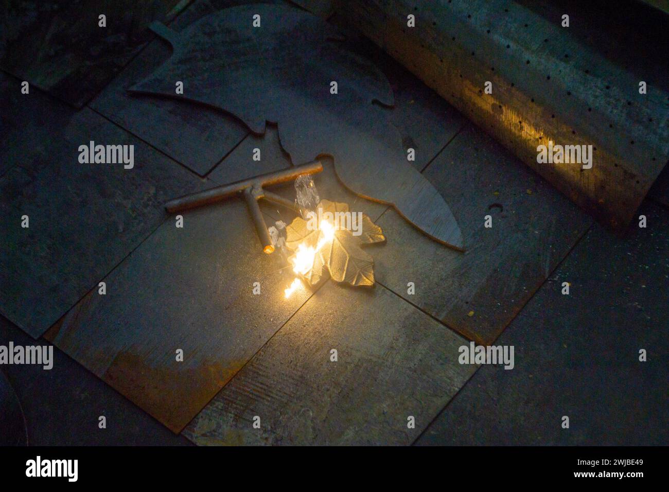 Laser cleaning of metal. The laser beam cleans the metal surface from ...