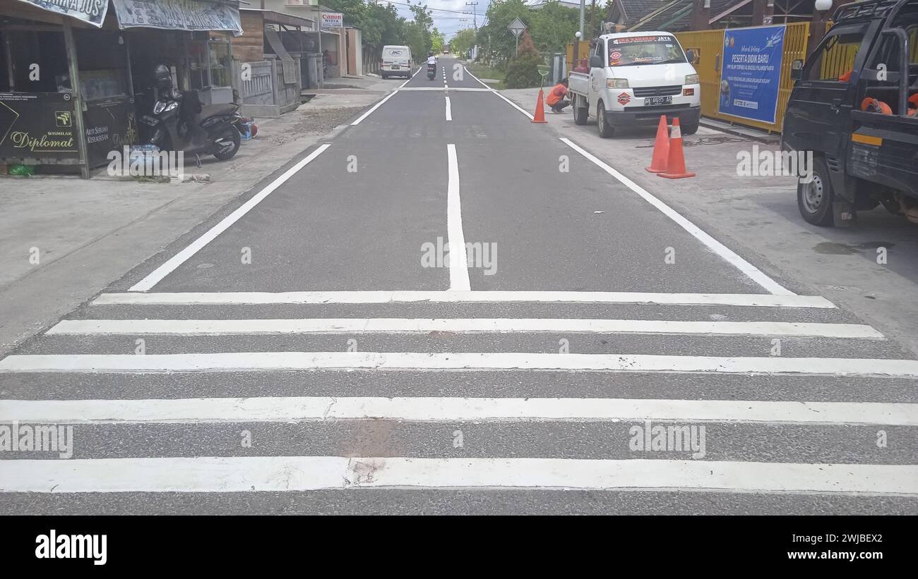 White dotted line on city asphalt road background Stock Photo - Alamy