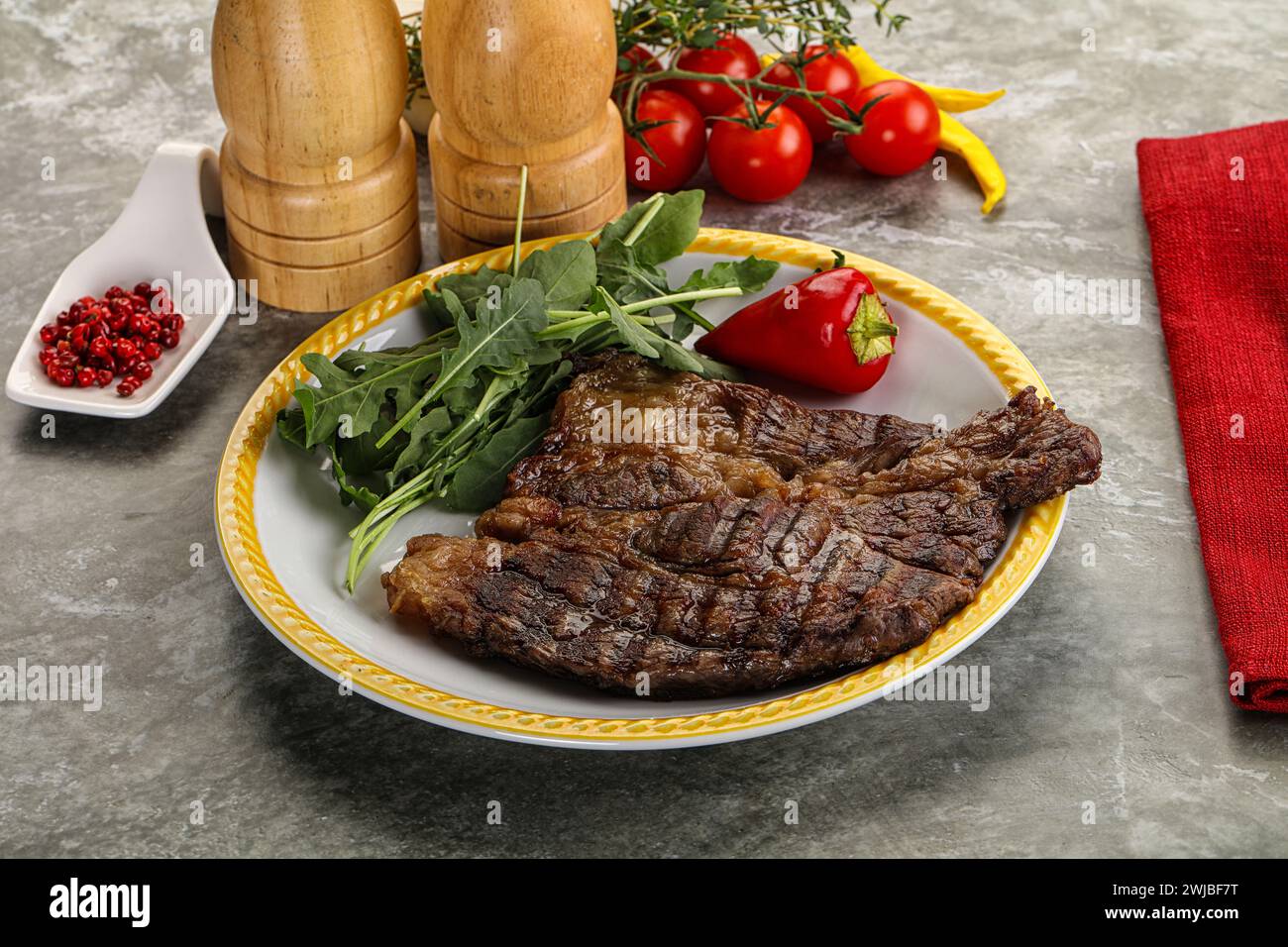 Grilled chuck roll beef steak with arugula Stock Photo - Alamy