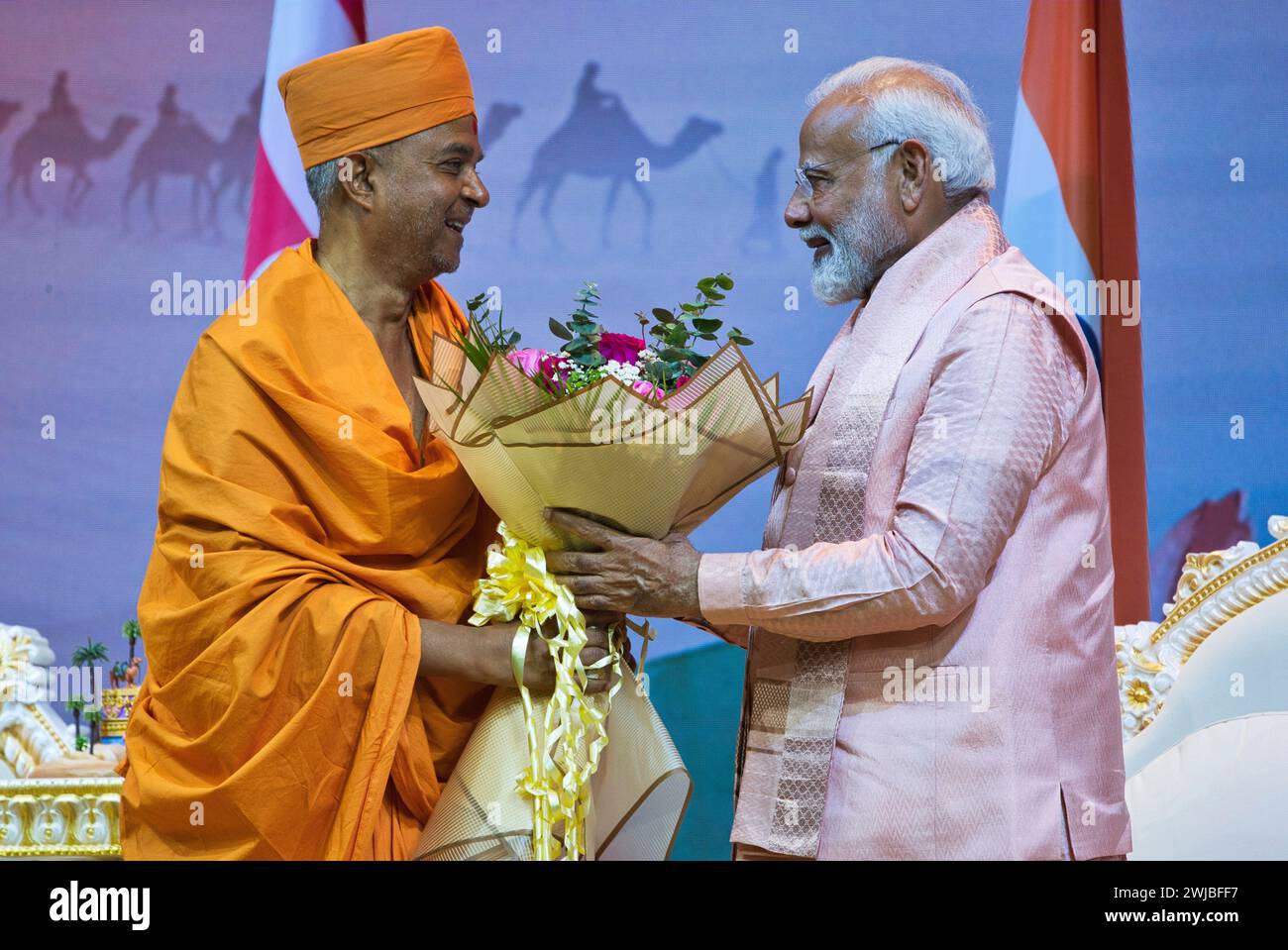 Indian Prime Minister Narendra Modi, right, is given a bouquet by Hindu ...