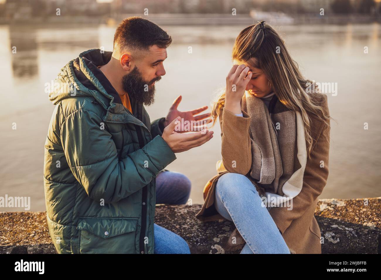 Couple having conflict and they are arguing while sitting outdoor Stock ...