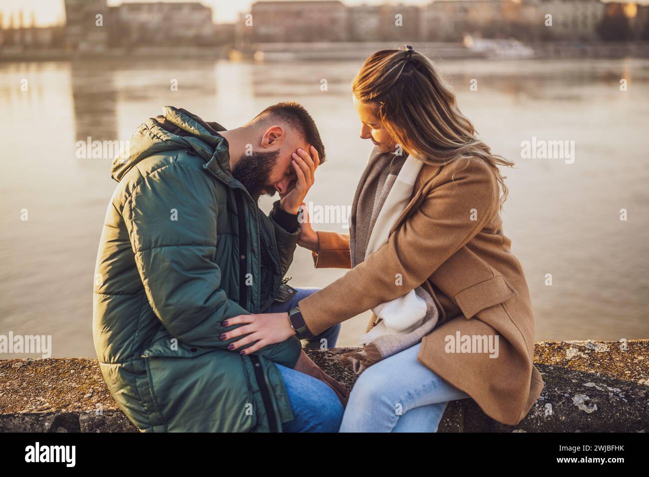 Couple having conflict and woman is trying to comfort her sad and angry ...