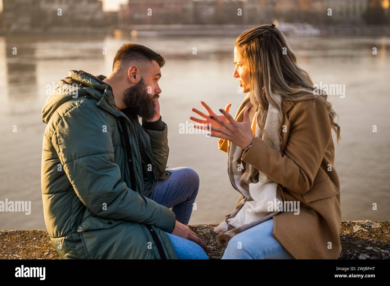 Couple having conflict and they are arguing while sitting outdoor Stock ...