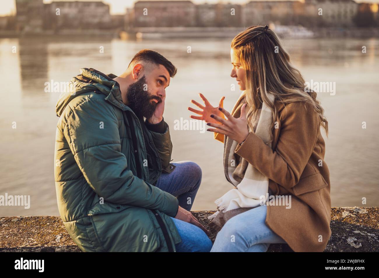 Couple having conflict and they are arguing while sitting outdoor Stock ...