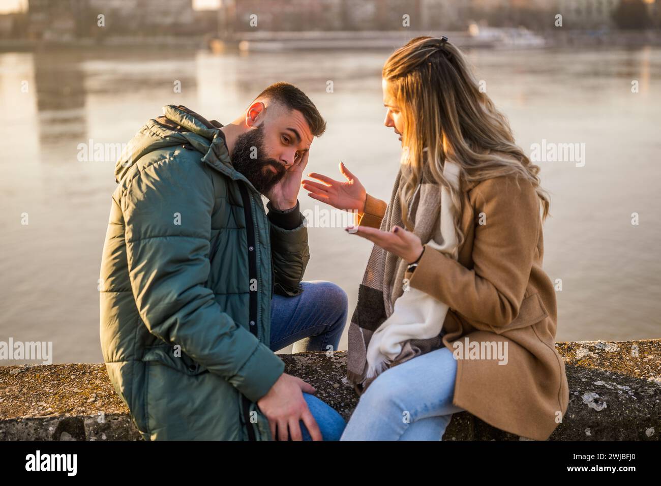 Couple having conflict and they are arguing while sitting outdoor Stock ...