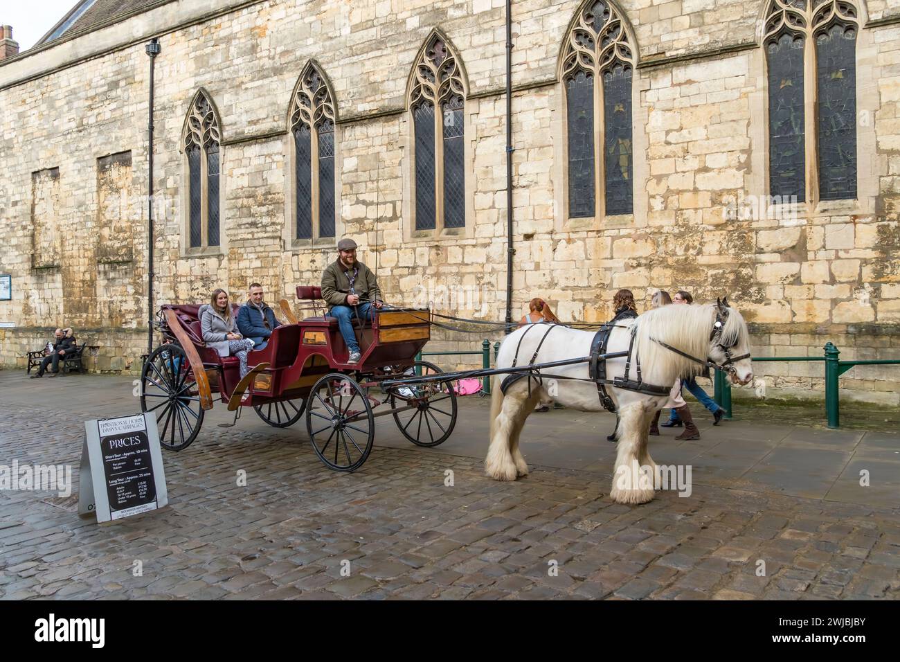 Couple going for ride in Horse drawn carriage, Exchequer Gate, Lincoln ...