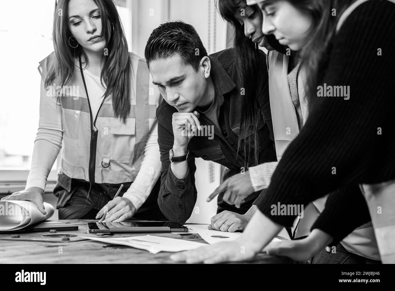 South american engineer supervisor at construction site with his ...