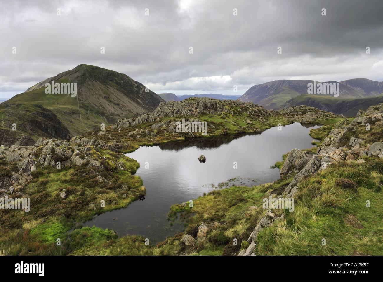 The summit carin of Haystacks Fell, overlooking Buttermere, Cumbria ...